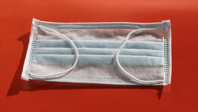 Medical Masks on a Red Background. Respiratory Protection Stock Photo ...