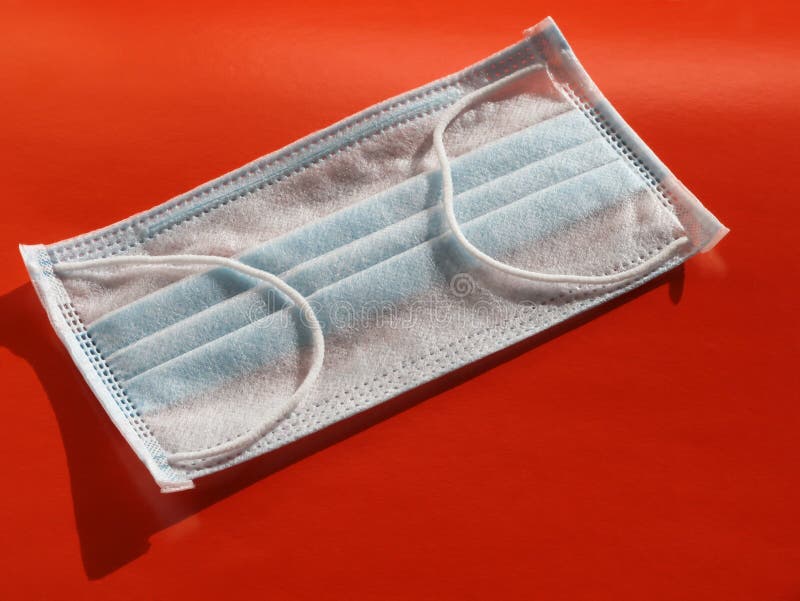 Medical Masks on a Red Background. Respiratory Protection Stock Photo ...