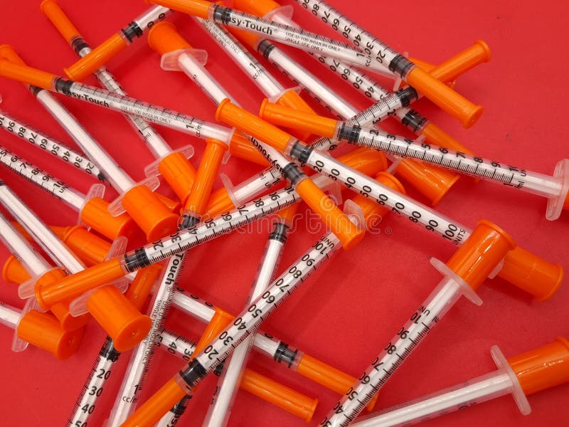 Medical Needles in a Pile on a Red Background Stock Photo - Image of ...