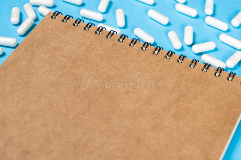 Medical Notepad with Pills on a Blue Background, Space for Text Stock ...
