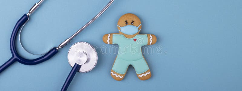 Medical Phonendoscope and Gingerbread Medic in a Mask on a Blue ...