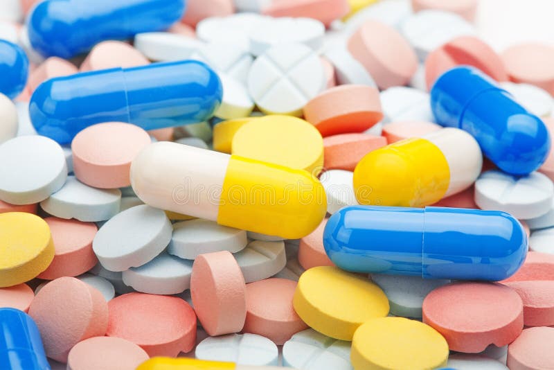 Medical Pills Blue and White on a Background of Colored Pills Stock ...