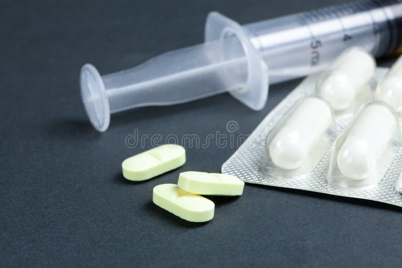 Medical pills on the table stock photo. Image of painkiller - 220115794