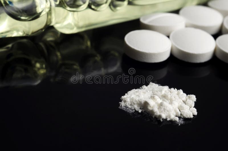 White Powder and Tablets on a Black Background Stock Photo - Image of ...