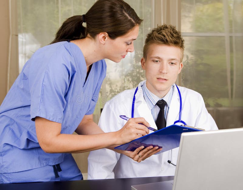 Happy Medical Staff Working Together Stock Image - Image of light ...