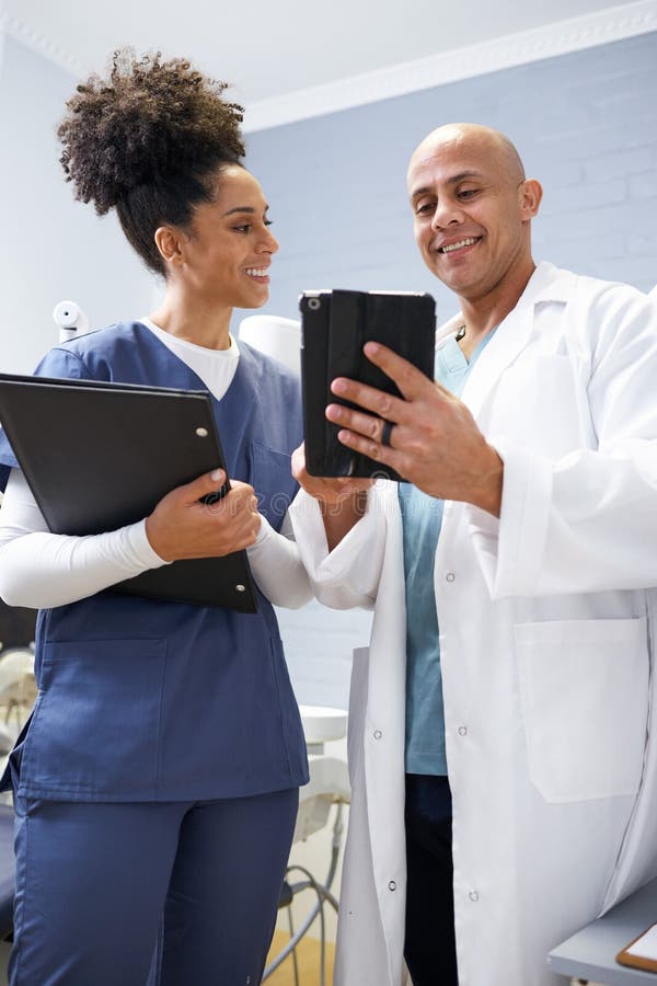 Medical Professionals Collaborating Using Technology Modern Clinic ...