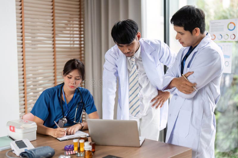 Medical Professionals Engaged in a Collaborative Analysis of Patient ...