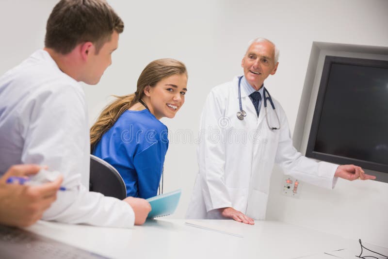 Medical Professor Teaching Young Students Stock Photo - Image of ...