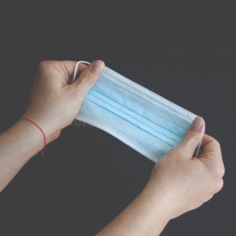 Medical Protective Blue Masks in the Hands of a Man Stock Photo - Image ...