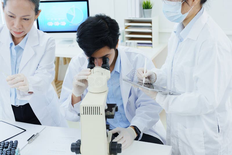 Scientists Analyze Chemical Samples Discuss Technological Innovations ...