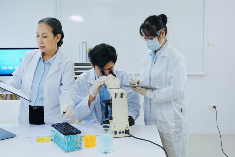 Scientists Analyze Chemical Samples Discuss Technological Innovations ...