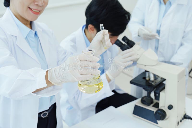 Scientists Analyze Chemical Samples Discuss Technological Innovations ...