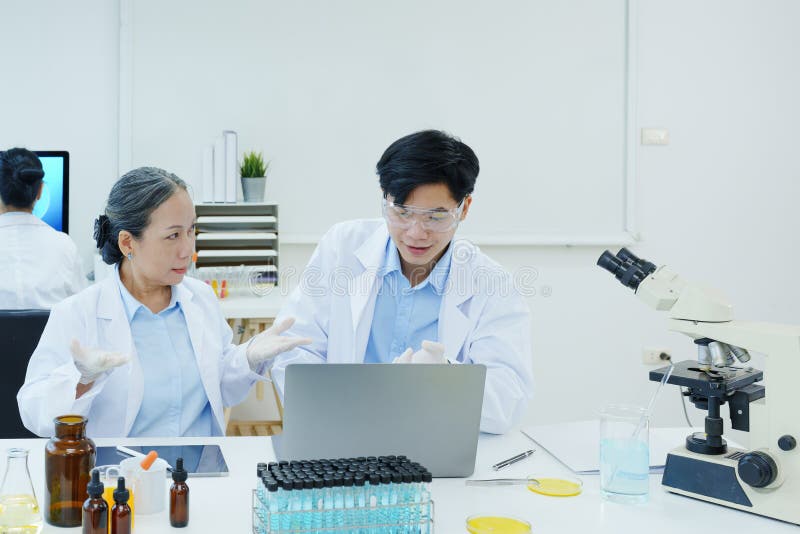 Scientists Analyze Chemical Samples Discuss Technological Innovations ...