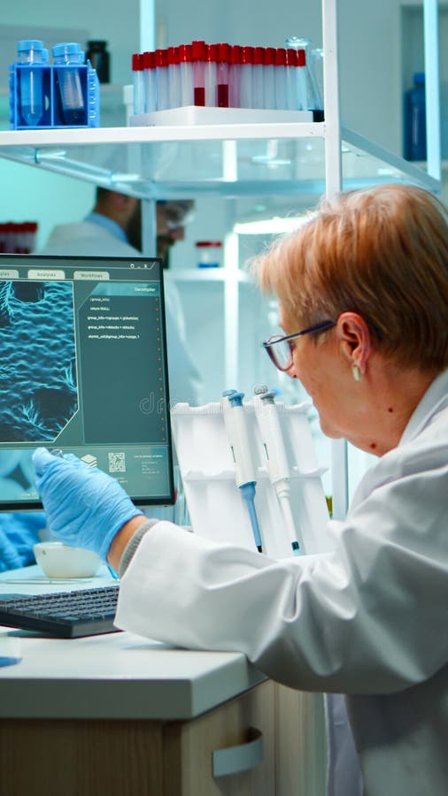 Medical Research Scientist Typing Genetic Codes on Pc Stock Image ...