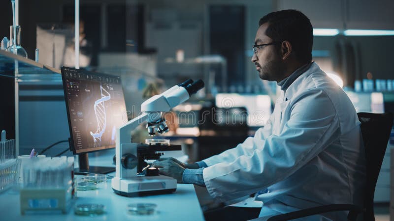 Medical Research Scientist is Using Desktop Computer Writes Results ...