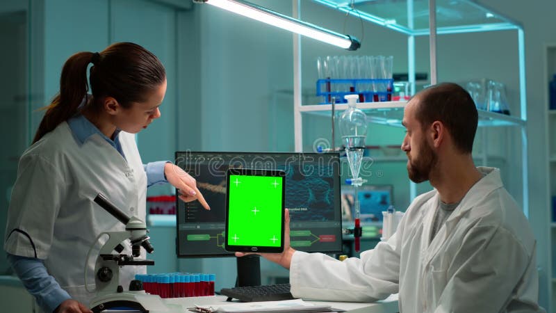 Medical Research Scientists Using Notepad with Green Screen Stock ...
