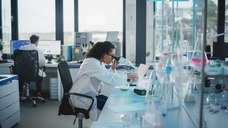 Medical Science Laboratory: Beautiful Black Scientist Looking Under ...
