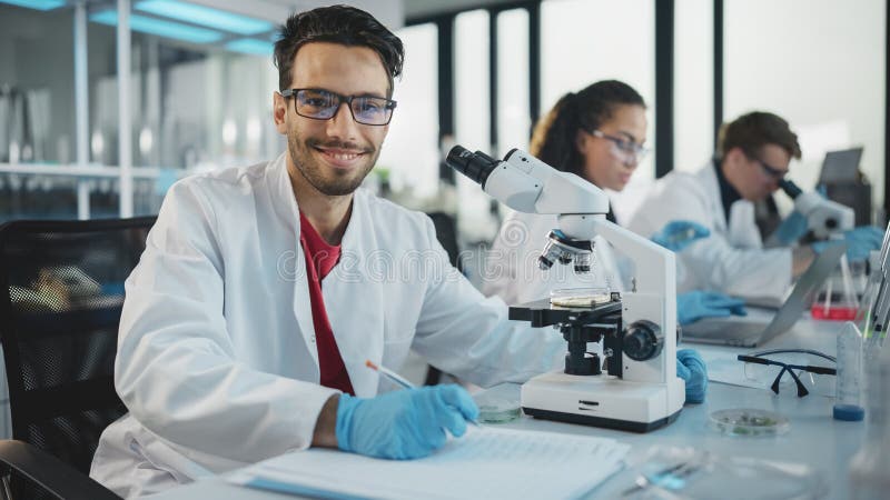 Medical Science Laboratory: Handsome Latin Scientist Analysing Samples ...