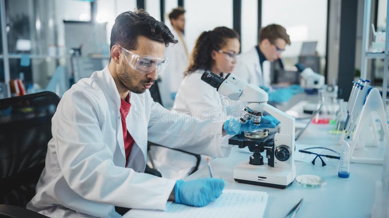 Medical Science Laboratory: Portrait Shot of a Handsome Latin Scientist ...