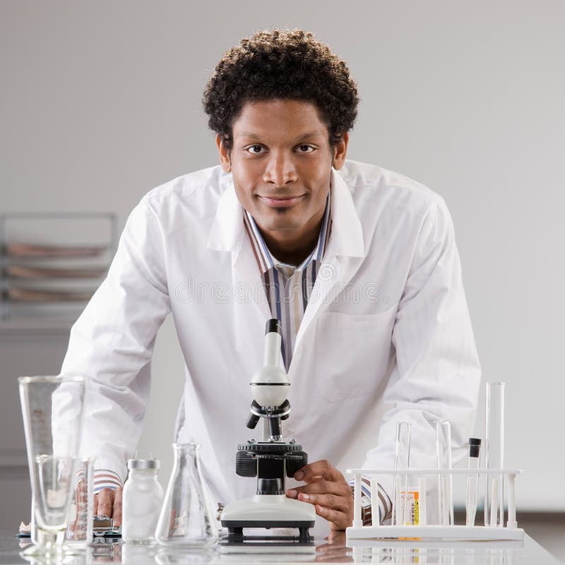 Portrait of Pupil Using Microscope in Science Lesson Stock Photo ...