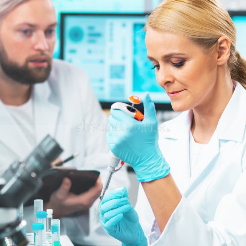 Medical Scientists Working in Lab. Doctor Teaching Interns To Make Analyzing Research Stock ...