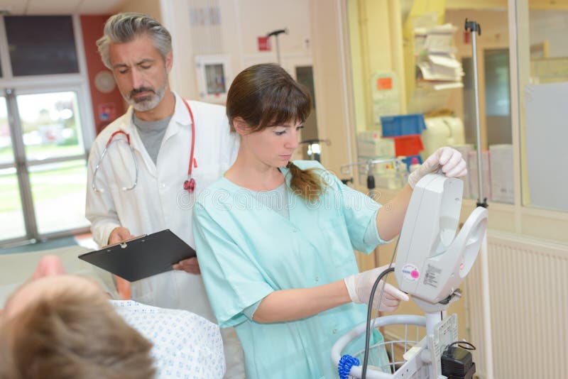 Medical Staff Around Patient Stock Image - Image of examination ...