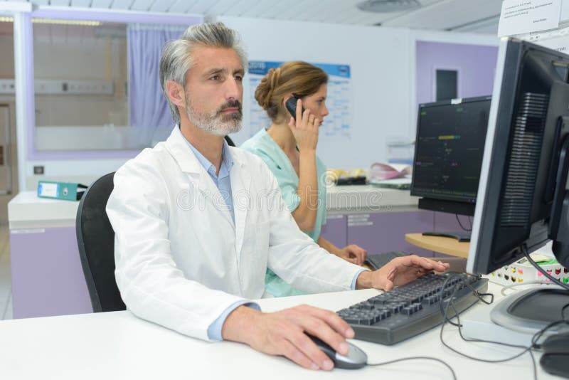 Medical Staff Using Computer and Telephone Stock Photo - Image of ...