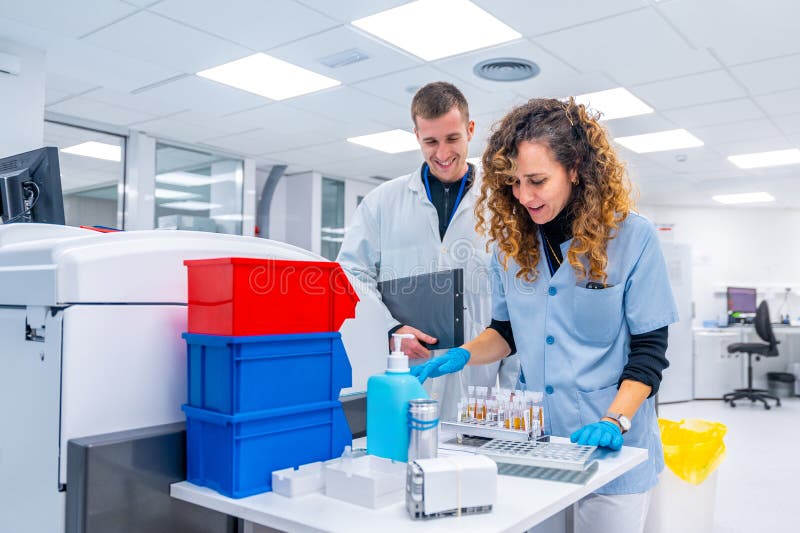 Medical Staff Working Together with Samples in the Laboratory Stock ...