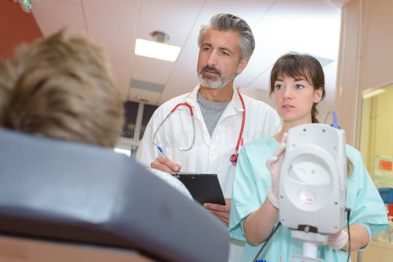 Medical Staffs Conducting Interview To Patient Stock Photo - Image of ...