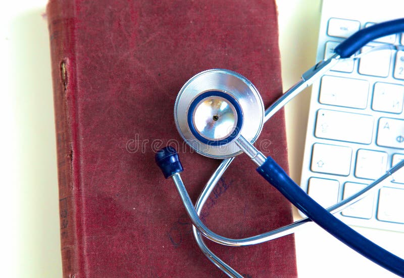 Medical Stethoscope with Books and Laptop on Table Stock Photo - Image ...