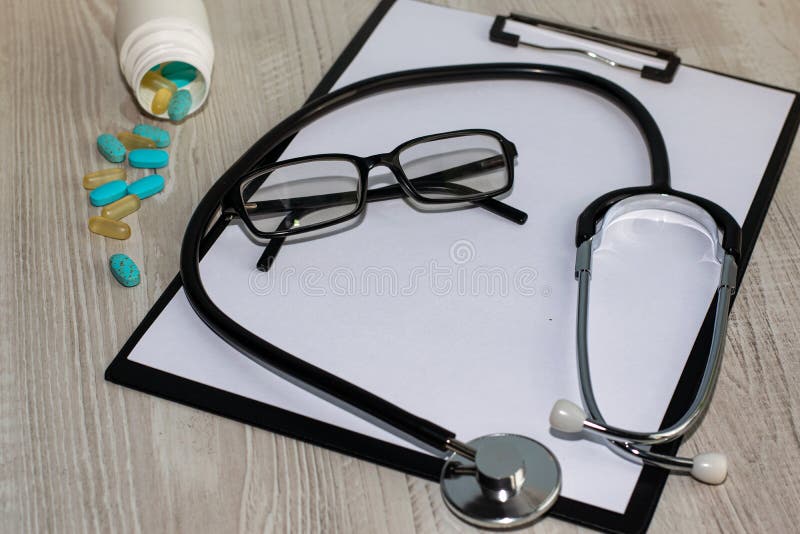 Medical Stethoscope And Clipboard With A Blank Sheet Of Paper Medical