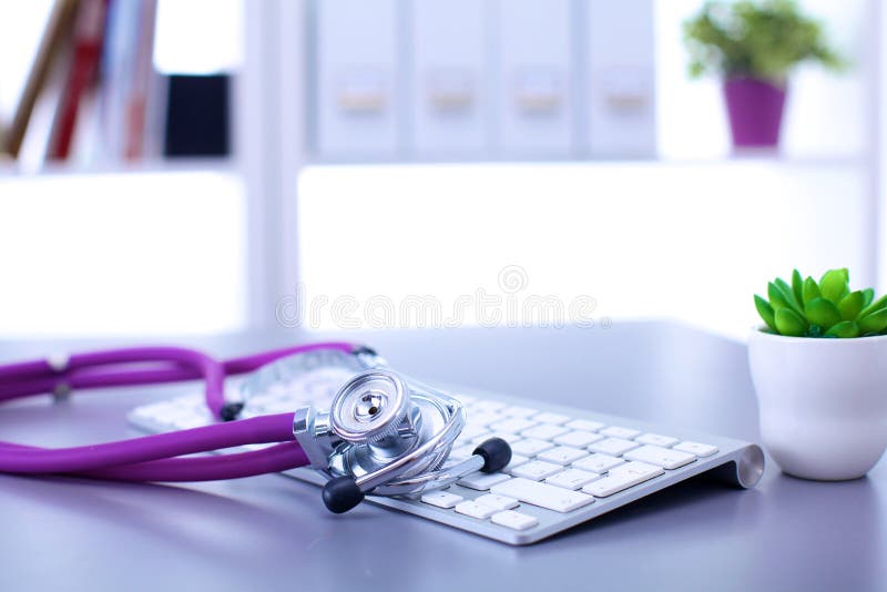 Medical Stethoscope with a Computer on the Desk Stock Image - Image of ...