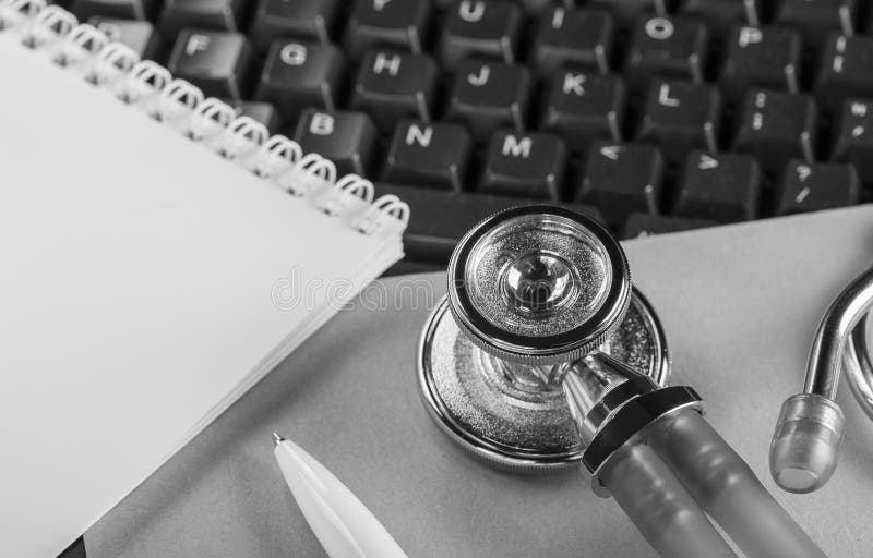 Medical Stethoscope on Computer Keyboard and Ballpoint Pen for Notes ...
