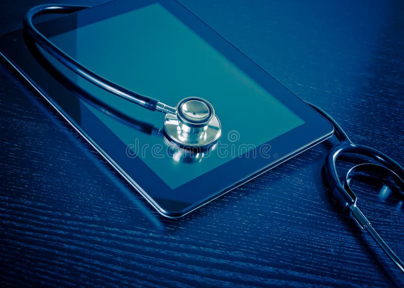Medical Stethoscope on Modern Digital Tablet Pc in Laboratory on Wood ...