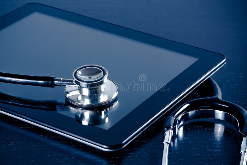 Medical Stethoscope on Modern Digital Tablet Pc in Laboratory on Wood ...