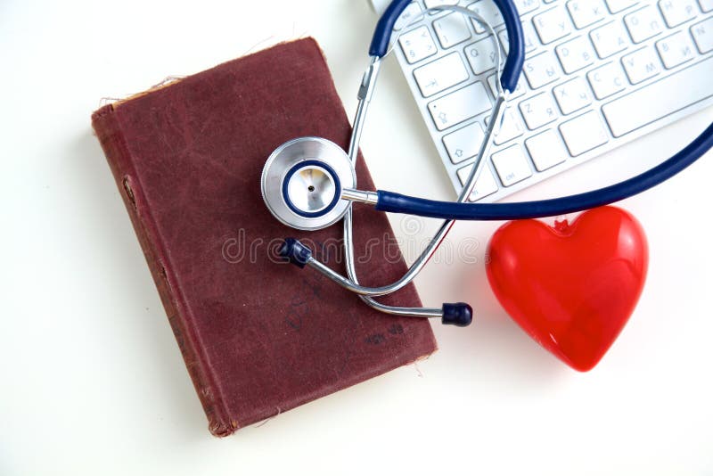Medical Stethoscope with Old Books and Laptop on a Table Stock Image ...