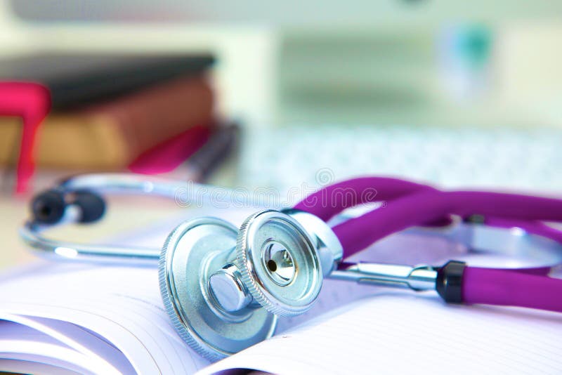 Medical Stethoscope with Old Books and Laptop on a Table Stock Photo ...