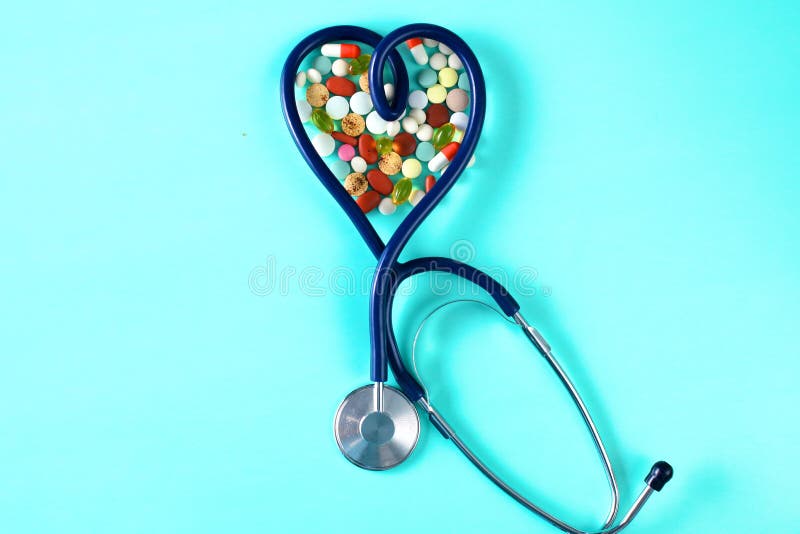 Medical Stethoscope With Pills On A Blue Background Stock Image Image