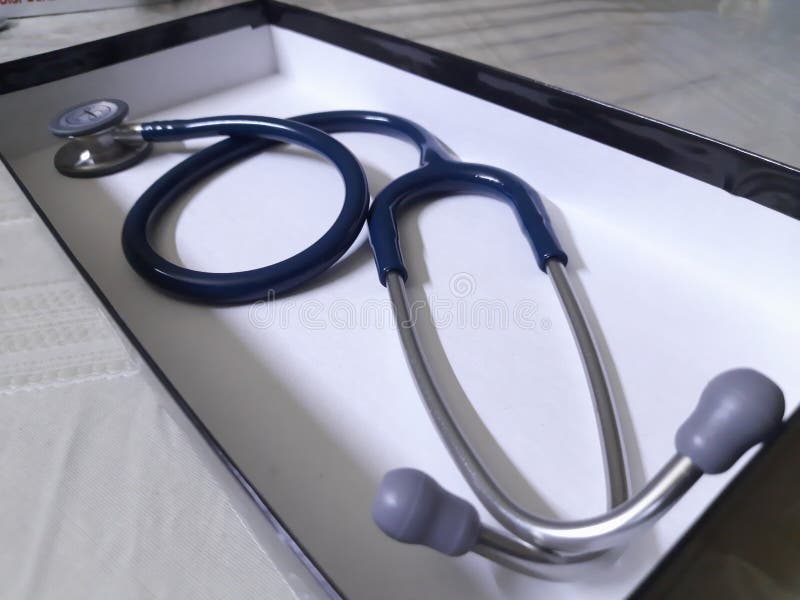 A Medical Stethoscope in a White Box on Table. Stock Photo - Image of ...
