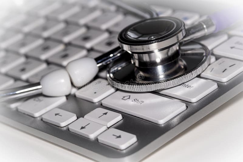 Medical Stethoscope on a White Computer Keyboard. Stock Image - Image ...