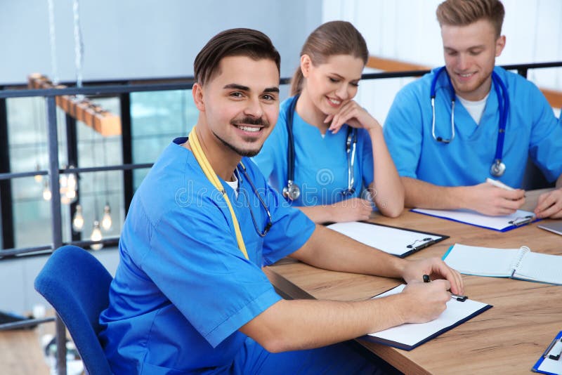 Medical Student with Groupmates in Library Stock Photo - Image of ...