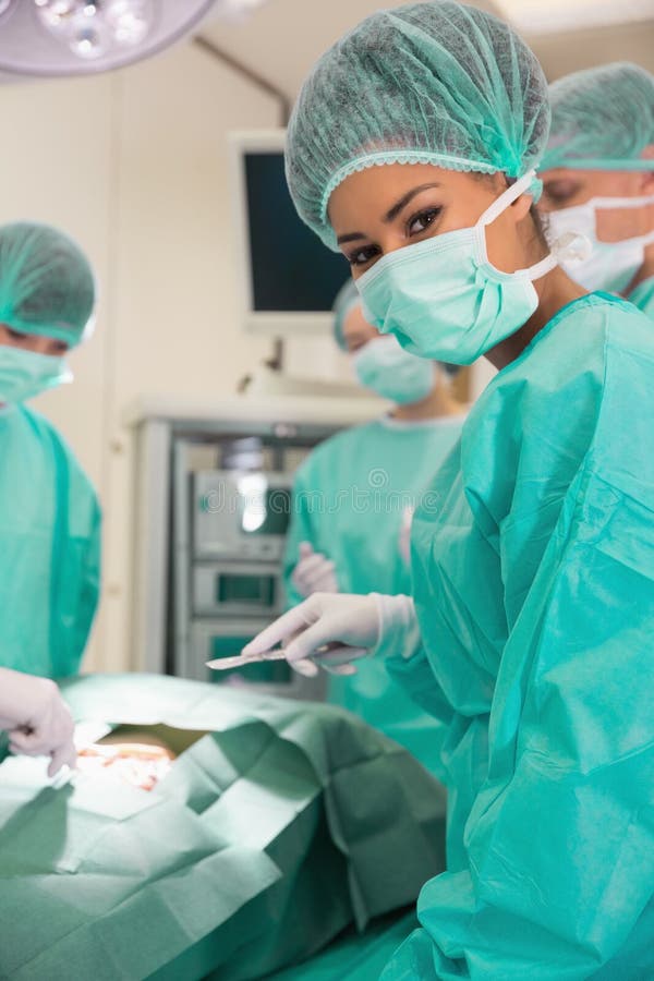 Medical Student Looking at Camera during Practice Surgery Stock Photo ...