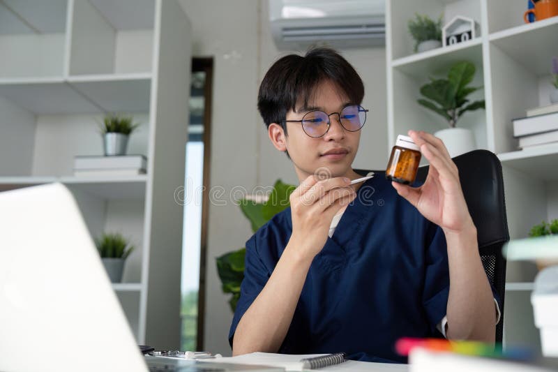 Medical Student Studying Medication Management in a Modern Office ...