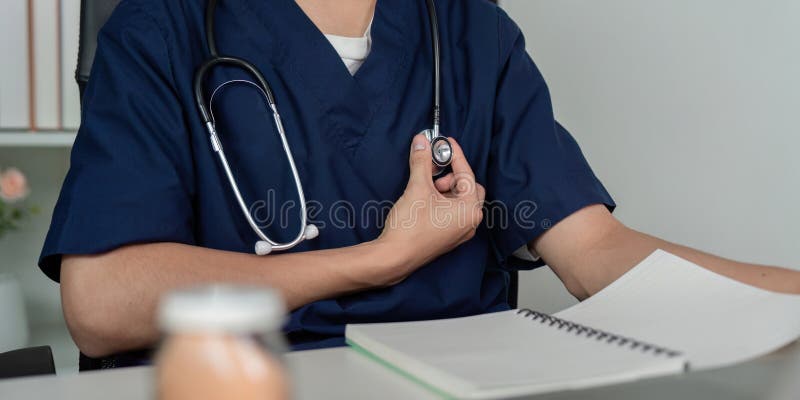 Medical Student Checking Vital Signs with a Stethoscope while Studying ...