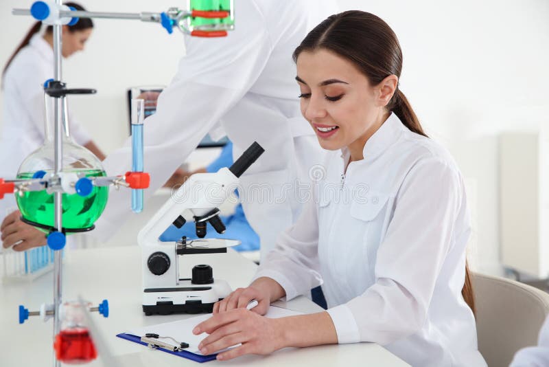Medical Student Working at Table in Laboratory Stock Image - Image of ...