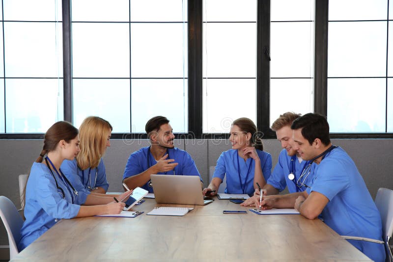 Medical Students in Uniforms Studying Stock Photo - Image of graduate ...