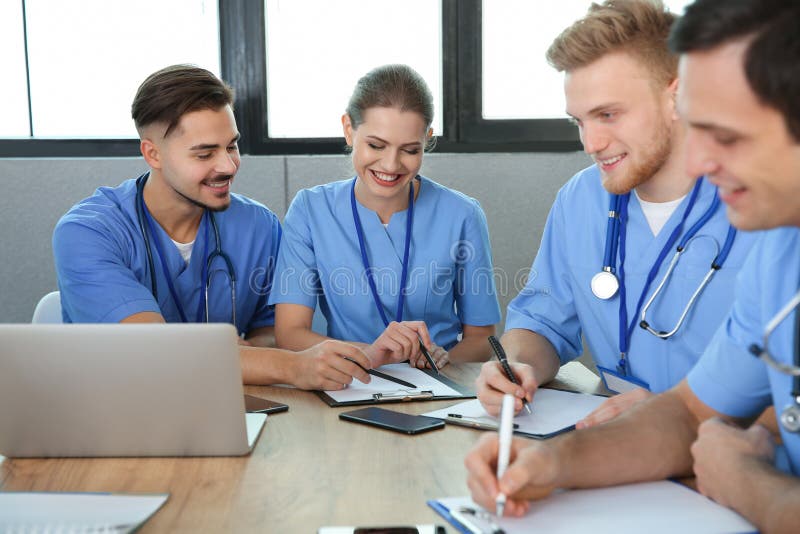 Medical Students in Uniforms Studying Stock Image - Image of research ...