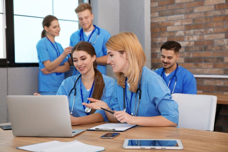 Medical Students in Uniforms Studying Stock Image - Image of class ...