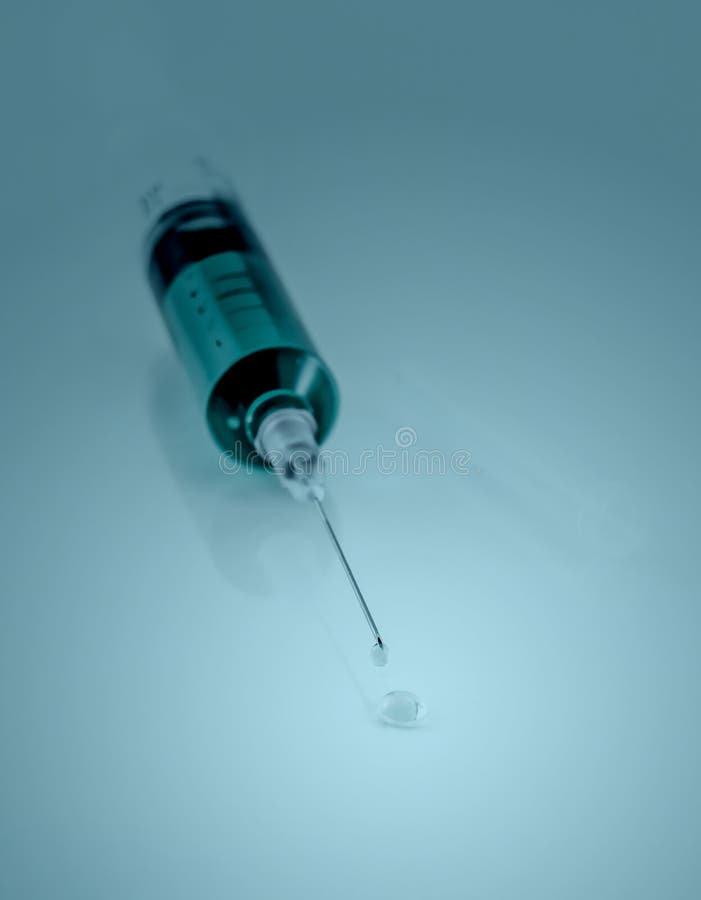 A Syringe with a Drop on the End of the Needle Stock Photo - Image of ...