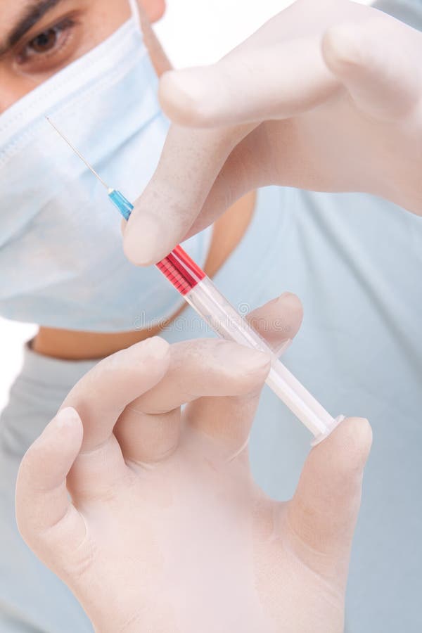 Medical syringe in hands stock image. Image of liquid - 17956807